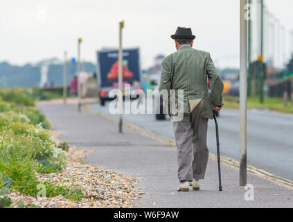 An old man using a walking stick Stock Photo - Alamy