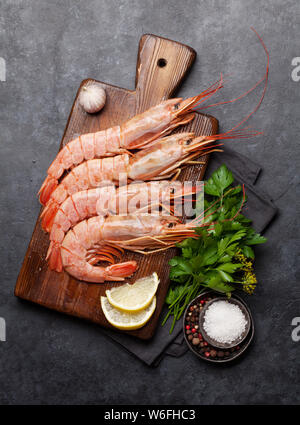 Shrimps on plate with lemon. Flat lay Stock Photo - Alamy
