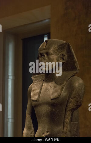 Praying ancient egypt statue of king Amenemhet isolated on white ...