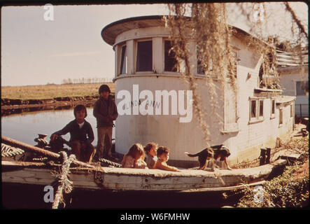 CHILDREN OF FISHERMEN PLAY ON SELDOM-USED BOAT 545957 Stock Photo - Alamy
