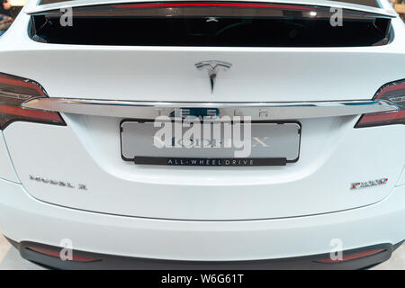 Valencia, Spain - July 21, 2019: Two buyers of a Tesla Model S electric ...