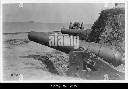 Distant view of Ft. Sumter from Fort Johnson, S.C.; The foreground weapon is a Confederate-made ...