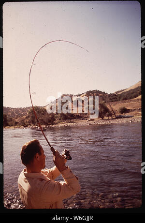 FISHING FOR RAINBOW TROUT BELOW DAM 542646 Stock Photo - Alamy