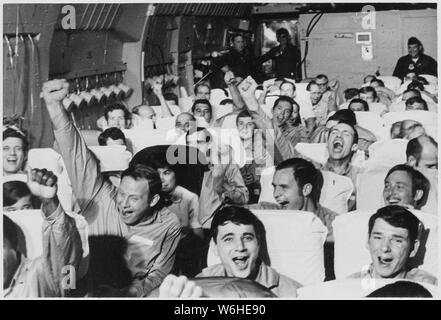 Vietnam War. American servicemen, former prisoners of war, are cheering ...