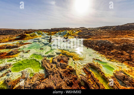Acidic pools, mineral formations, salt deposits in the crater of Dallol ...
