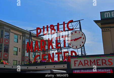 The iconic clock and sign for the Pike Place Market in downtown Seattle ...