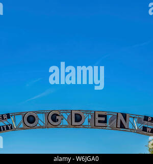 Welcome arch at the city of Ogden Utah against vivid blue sky and puffy ...