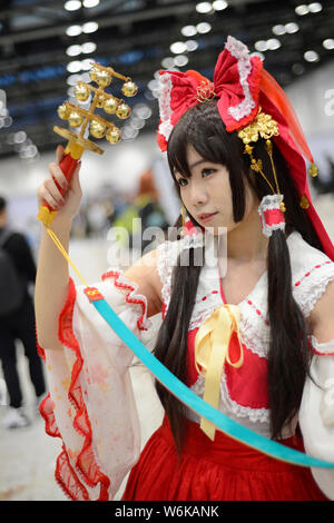 A Chinese coser dressed in cosplay costume poses during an animation ...