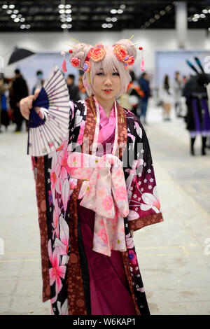 A Chinese coser dressed in cosplay costume poses during the Beijing ...