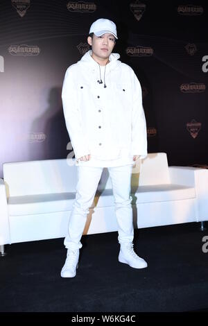 --FILE--Chinese rapper Wang Hao, better known as PG One, arrives for ...