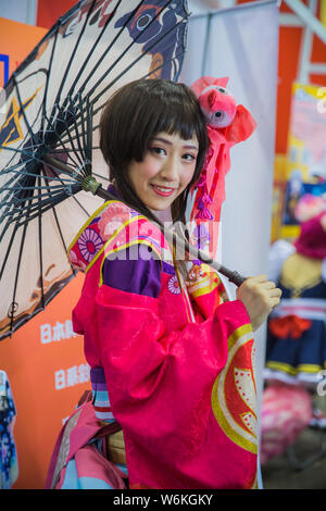 --FILE--A Chinese coser dressed in cosplay costume poses during the 6th ...