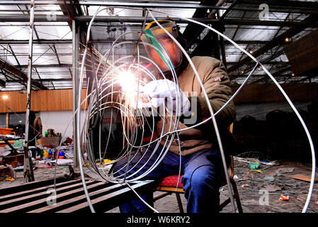 A Chinese craftsman, from Zigong city southwest China's Sichuan ...