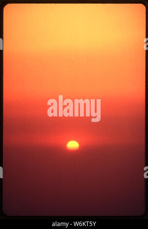 SUNSET SEEN THROUGH HEAVY SMOG Stock Photo - Alamy