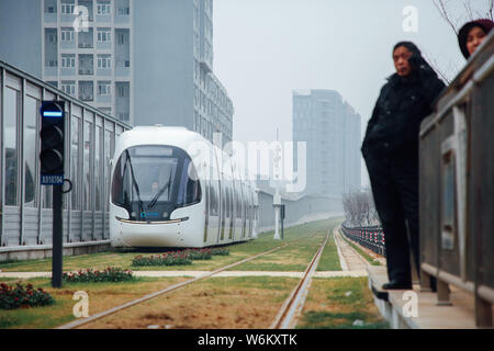 An "Optics Valley Quantum" tram runs during the trial operations of two ...