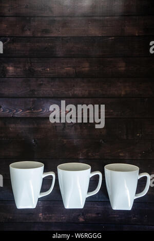 Many cups of coffee on wooden background Stock Photo - Alamy