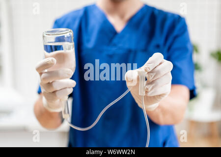 IV Infusion Set with Needle in hand Stock Photo - Alamy