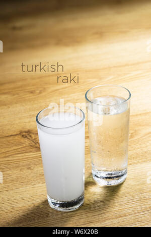 Turkish Raki with water on table with sliced melon and appetizer ...