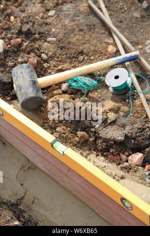Concrete curb installation. String line level guide is stretched ...