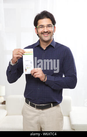 Portrait Of Indian Man Showing Aadhar Card Stock Photo - Alamy