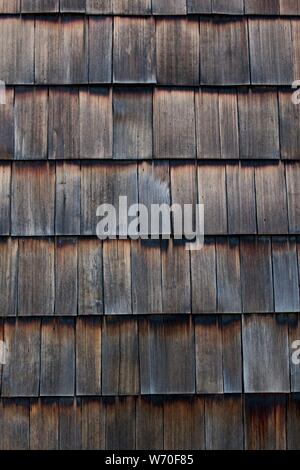 Sun bleached weathered cedar siding wall with knots and wood grain ...