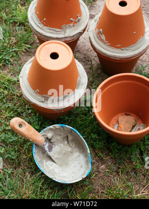 Making clay pot iirrigation system using unglazed terracotta pots Stock ...