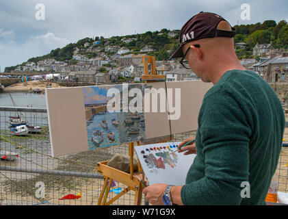 Mousehole, Cornwall, UK. 4th August 2019. Seen here Tim Hall, a former ...