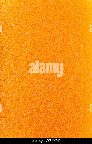 An orange porous synthetic texture background Stock Photo - Alamy