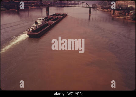 A barge on the Monongahela River shows the visible effects of pollution ...