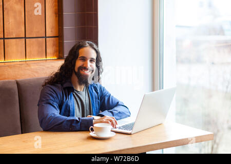 Portrait of satisfied handsome intelligence young adult man freelancer ...