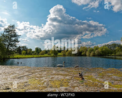 Summer sky. Cumulus clouds on a blue background. Partly cloudy. Dark ...