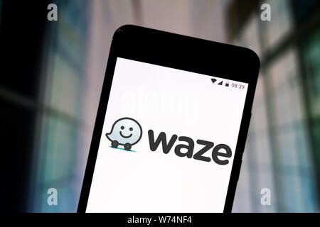 In this photo illustration, the Waze logo is displayed on a smartphone ...