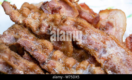 Parchment with cooked bacon rashers on table Stock Photo - Alamy