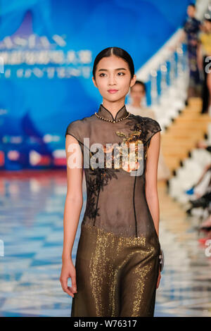 A contestant displays a creation during the 11th Asian Supermodel ...
