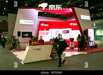 People visit the stand of JD Logistics of Chinese online retailer JD ...