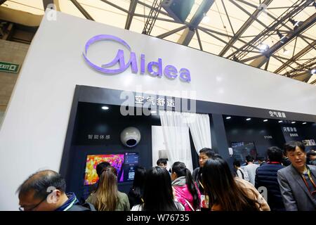 --FILE--People visit the stand of Midea during an exhibition in ...