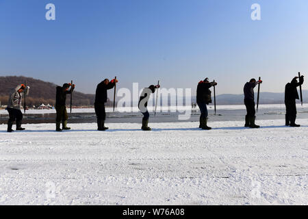 Workers collect ice blocks in Jiangbin Park to build an ice and snow ...