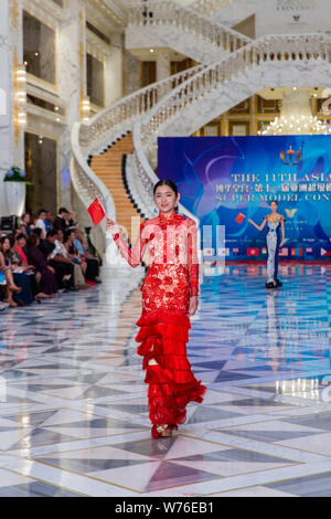 A contestant displays a creation during the 11th Asian Supermodel ...