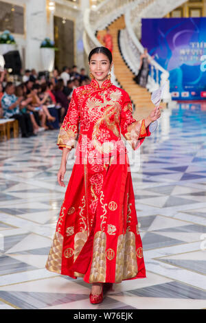 A contestant displays a creation during the 11th Asian Supermodel ...