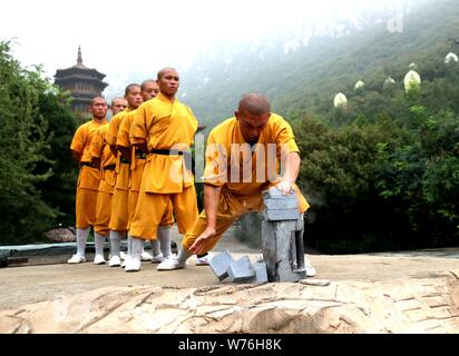 Henan,CHINA-Shaolin boys practice kung fu in the sweltering heat during ...