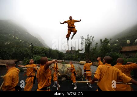 Henan,CHINA-Shaolin boys practice kung fu in the sweltering heat during ...