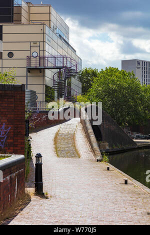 The Digbeth Branch Canal heads south into the city centre, the sunlight ...