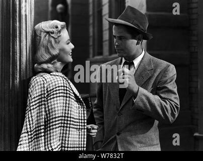 JANIS CARTER, GLENN FORD, FRAMED, 1947 Stock Photo - Alamy