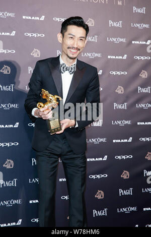 Taiwanese actor Chen Chu-sheng poses with his trophy of the Best ...