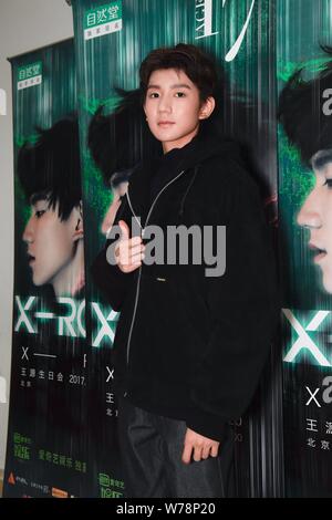 Roy Wang or Wang Yuan of Chinese boy group TFBoys poses at a press ...