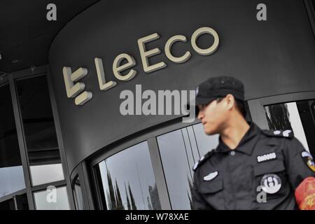 FILE - A police officer stands guard inside the St. Francis Catholic ...