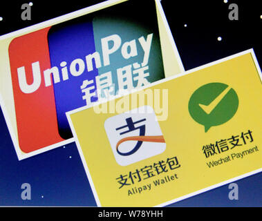--FILE--View of logos of China UnionPay, left, and Quickpass at a ...
