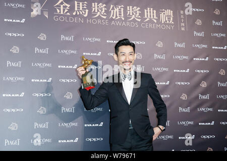 Taiwanese actor Chen Chu-sheng poses with his trophy of the Best ...