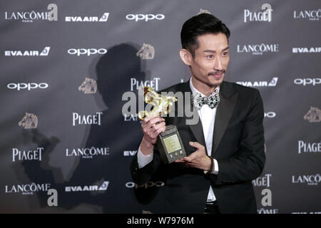 Taiwanese actor Chen Chu-sheng poses with his trophy of the Best ...