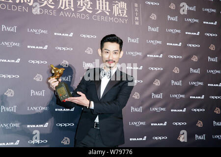 Taiwanese actor Chen Chu-sheng poses with his trophy of the Best ...