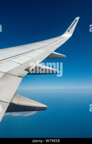 View out the window of a Ryanair Boeing 737-800 flight in the early ...